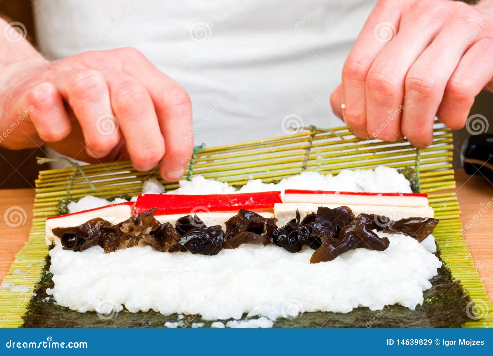 Rolling sushi stock image. Image of oriental, japanese - 14639829