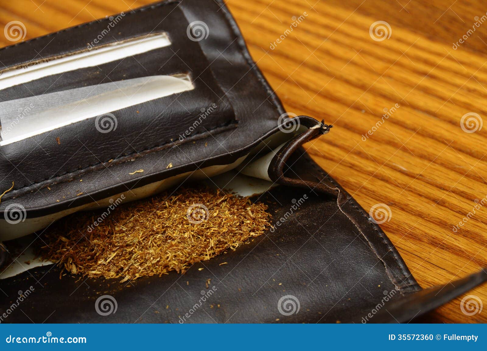 Man Rolling Tobacco Cigarette Royalty-Free Stock Photo | CartoonDealer ...