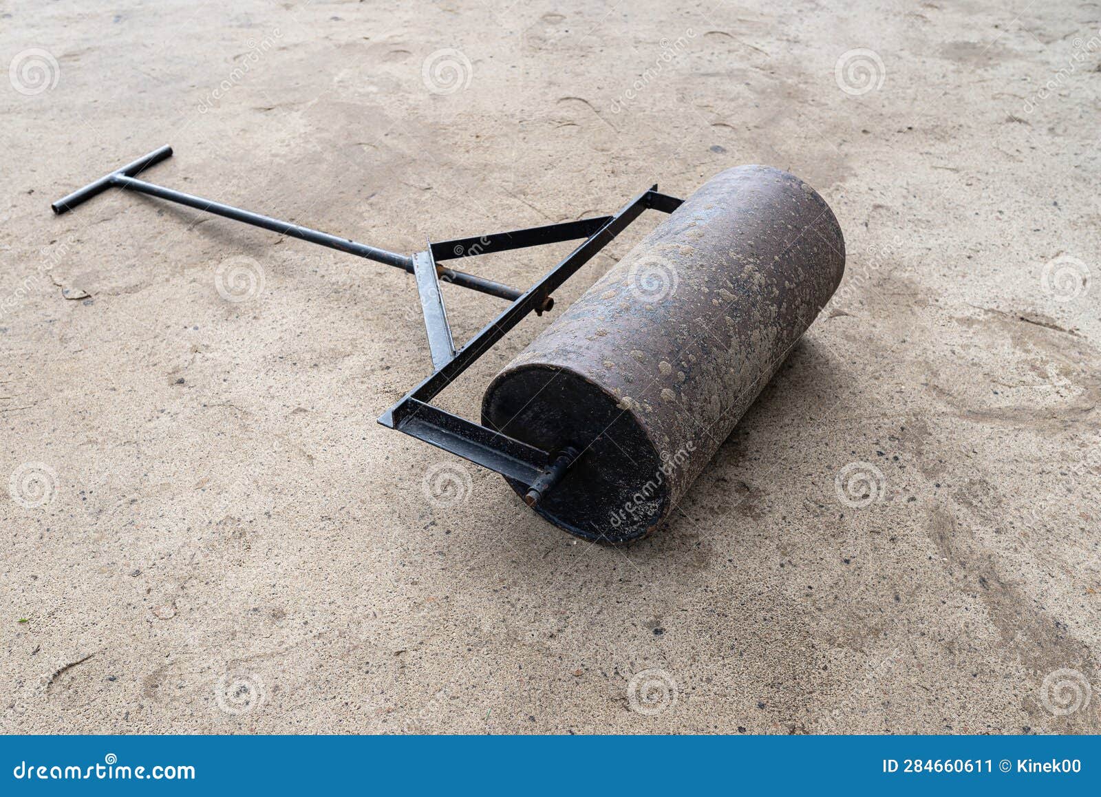 Rolling Yellow Sand with a Steel Roller for a Garden Pool. Stock Image ...