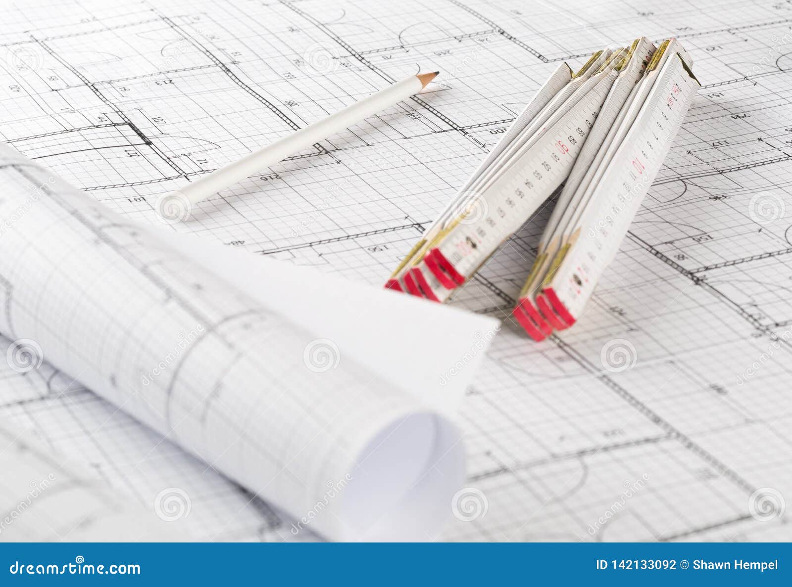 Rolls Of Architectural Blueprint House Building Plans With Pencil And ...