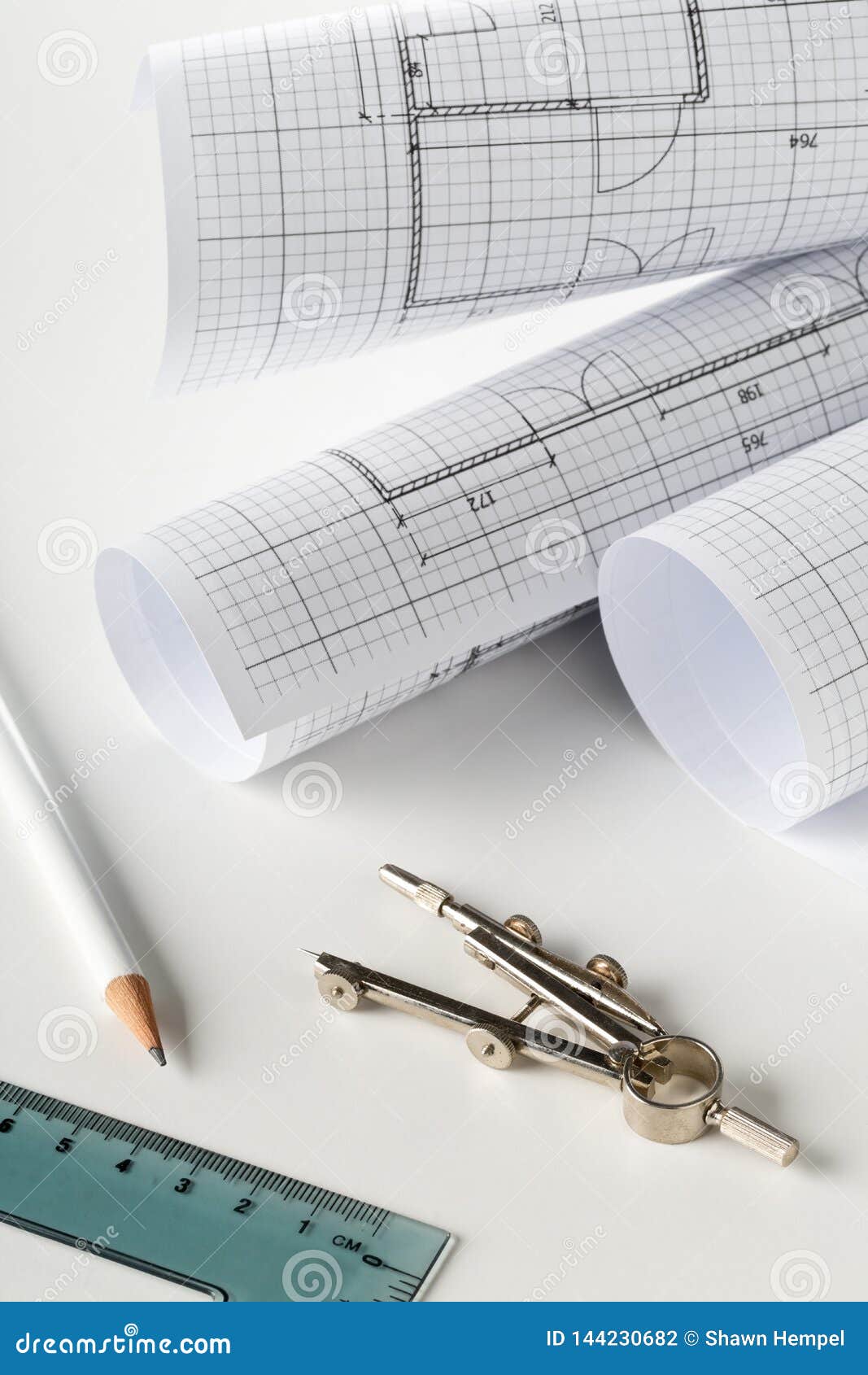 Rolls of Architectural Blueprint House Building Plans on White Table ...