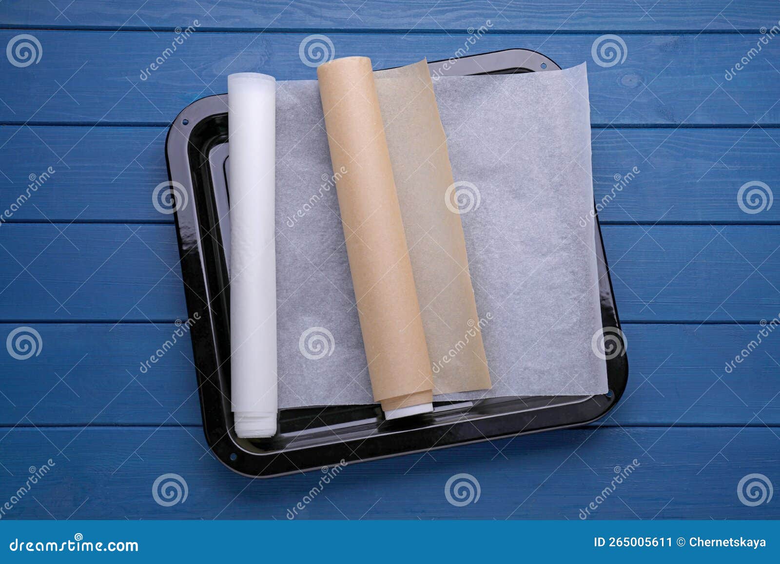 Rolls of Baking Parchment Paper on Blue Wooden Table, Top View Stock ...