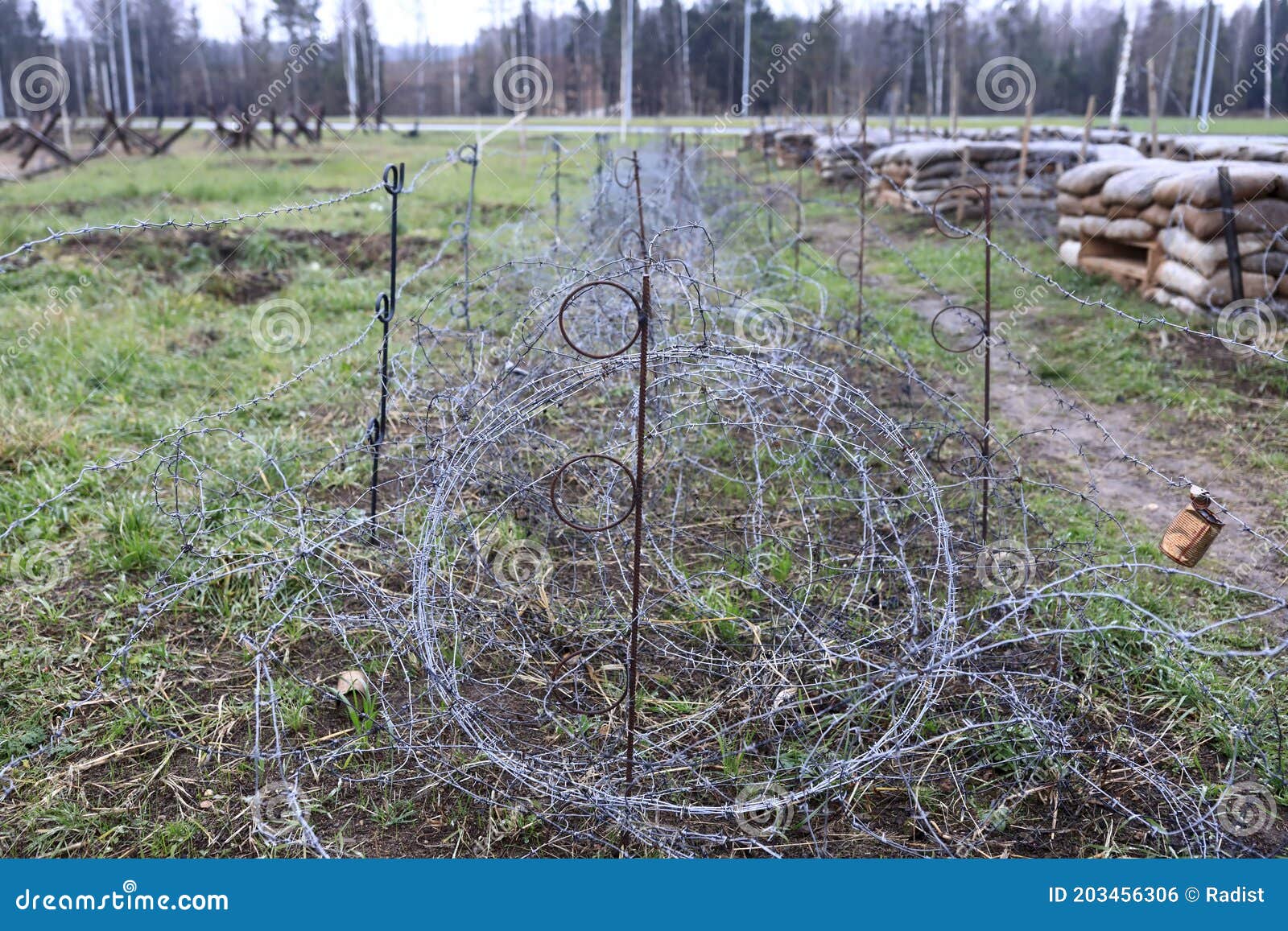 Rolls of Barbed Wire on Battlefield Editorial Photo - Image of crawl ...