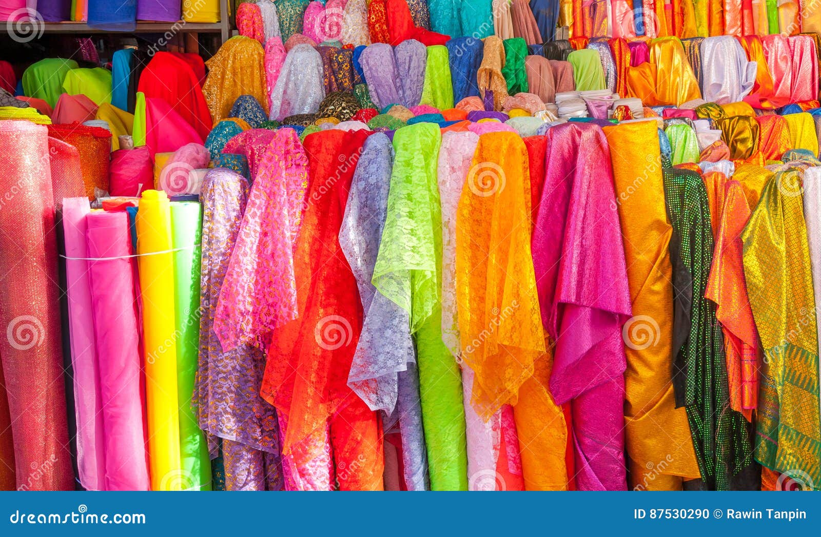 Rolls Colorful of Brightly Coloured Fabrics and Cloths Store Stock ...
