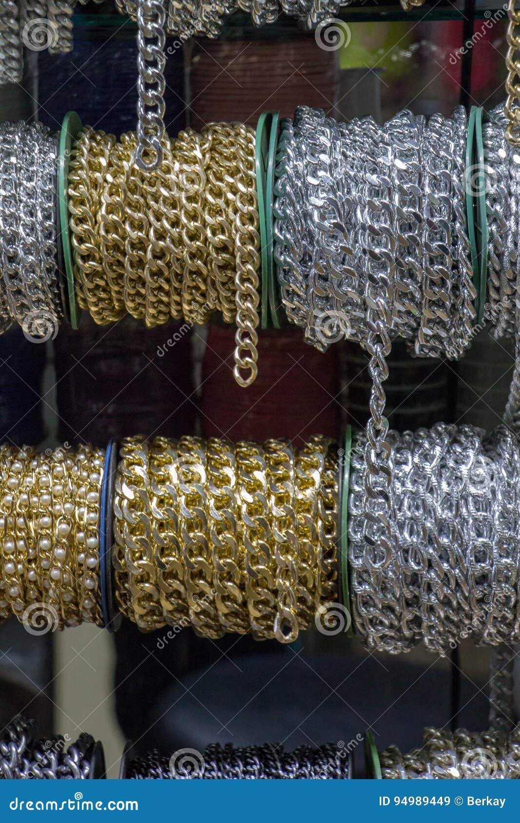 Rolls of decorative chains stock image. Image of holding - 94989449