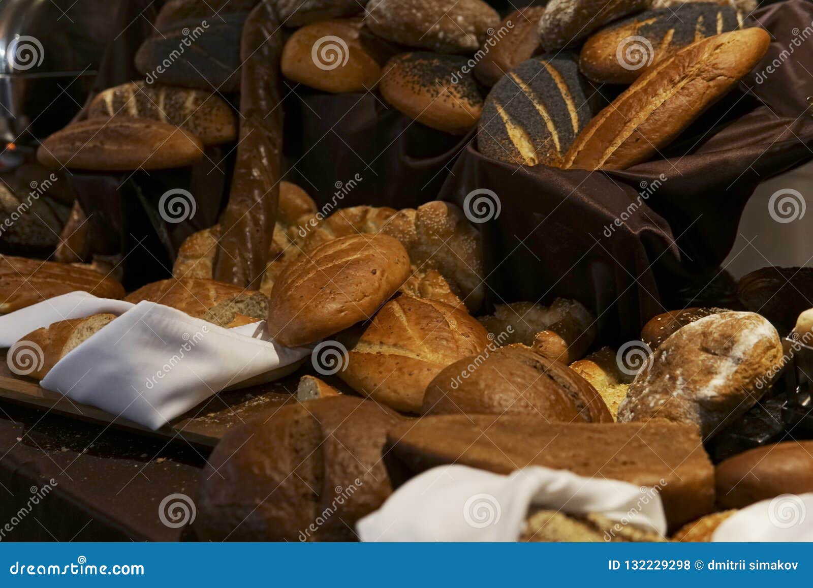 Many Rolls of Different Breads in the Bakery Restaurant Stock Photo ...