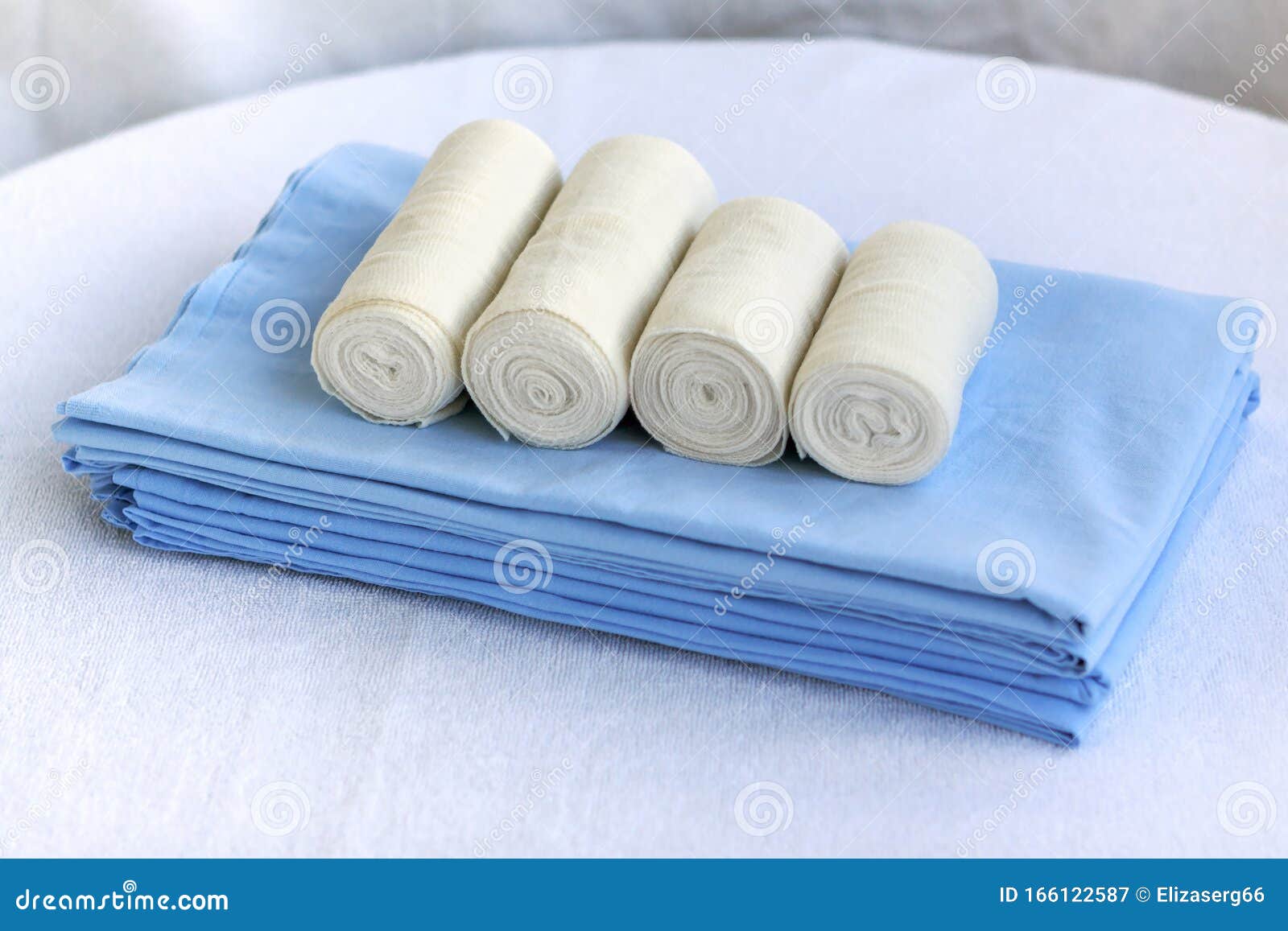 Rolls of Elastic Bandages Lie on Blue Sheets Stock Image - Image of ...