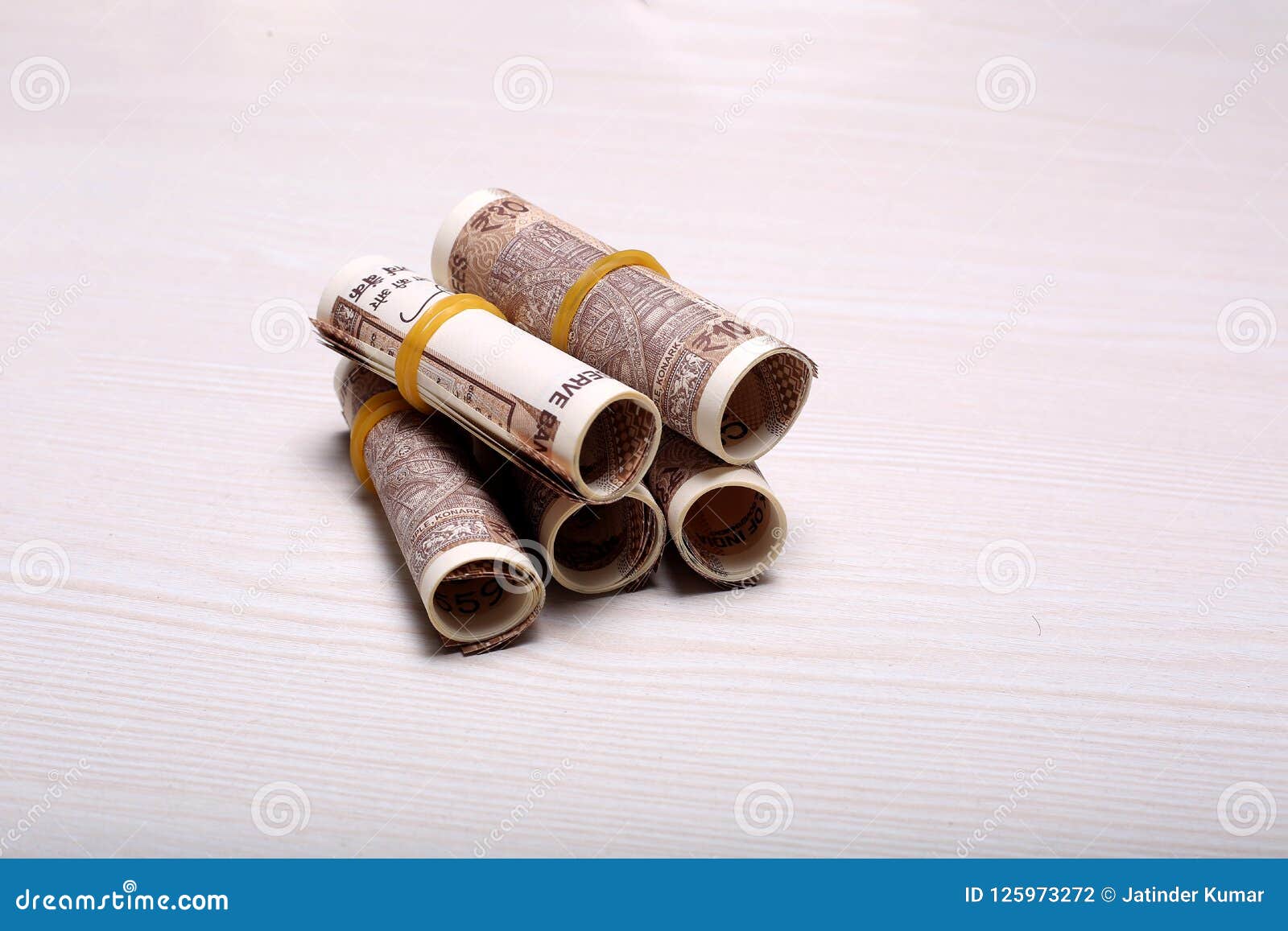 Rolls Of Indian Currency Rupee Notes With Magnifying Glass Royalty-Free ...