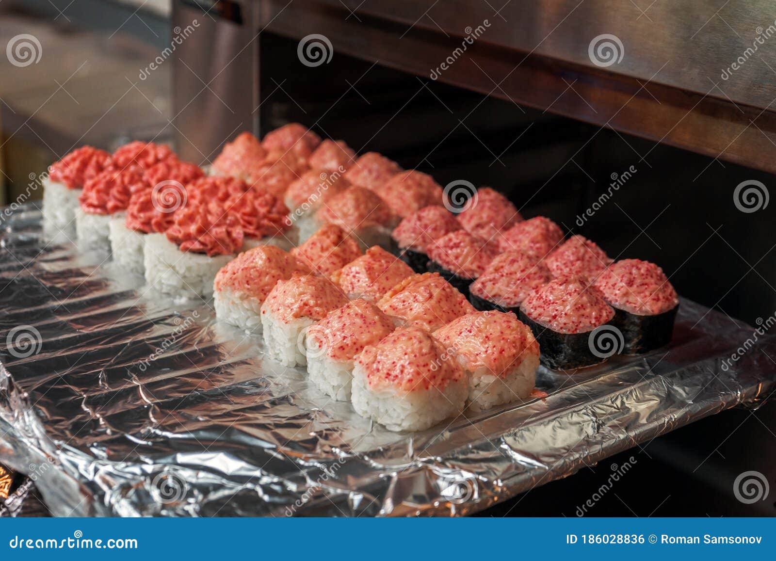 Rolls with Mayonnaise Caps on a Baking Plate are Shoved into the Oven ...