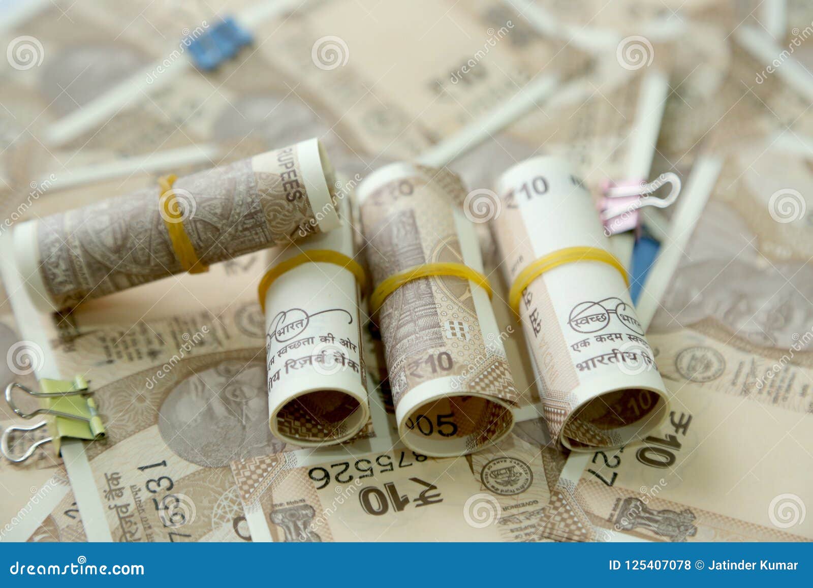 Rolls of New 10 Indian Rupee on the 10 Indian Rupee Notes Stock Photo ...