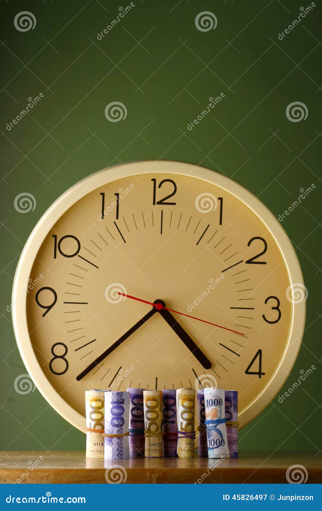 Rolls of Paper Money an Analog Clock Stock Image - Image of financial ...