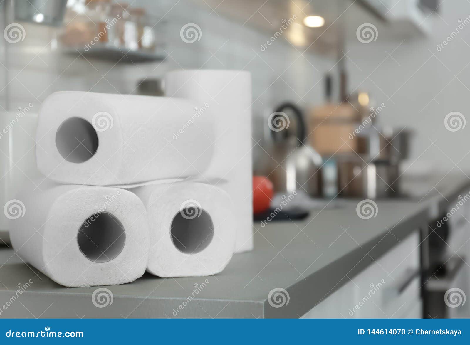Rolls of Paper Towels on Table in Kitchen, Stock Photo - Image of copy ...