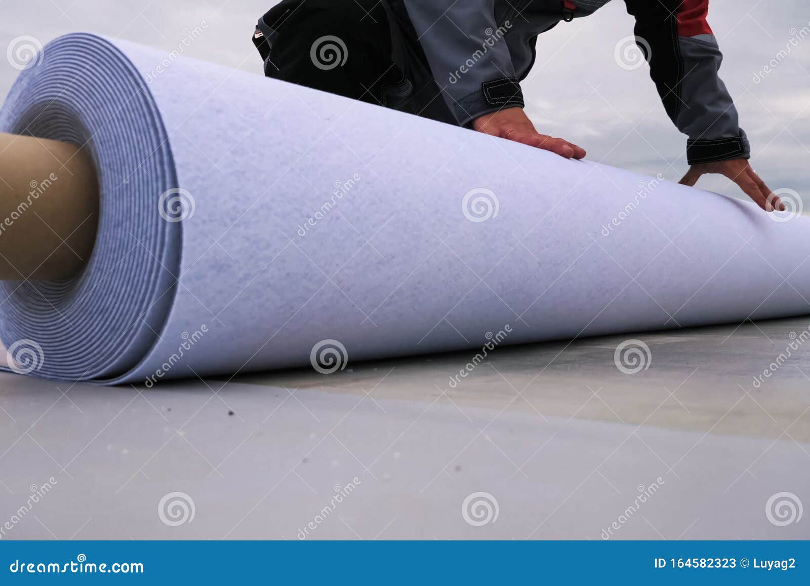 Rolls of Polymer Coating for Roof. Deployment of a Roof Covering Roll ...
