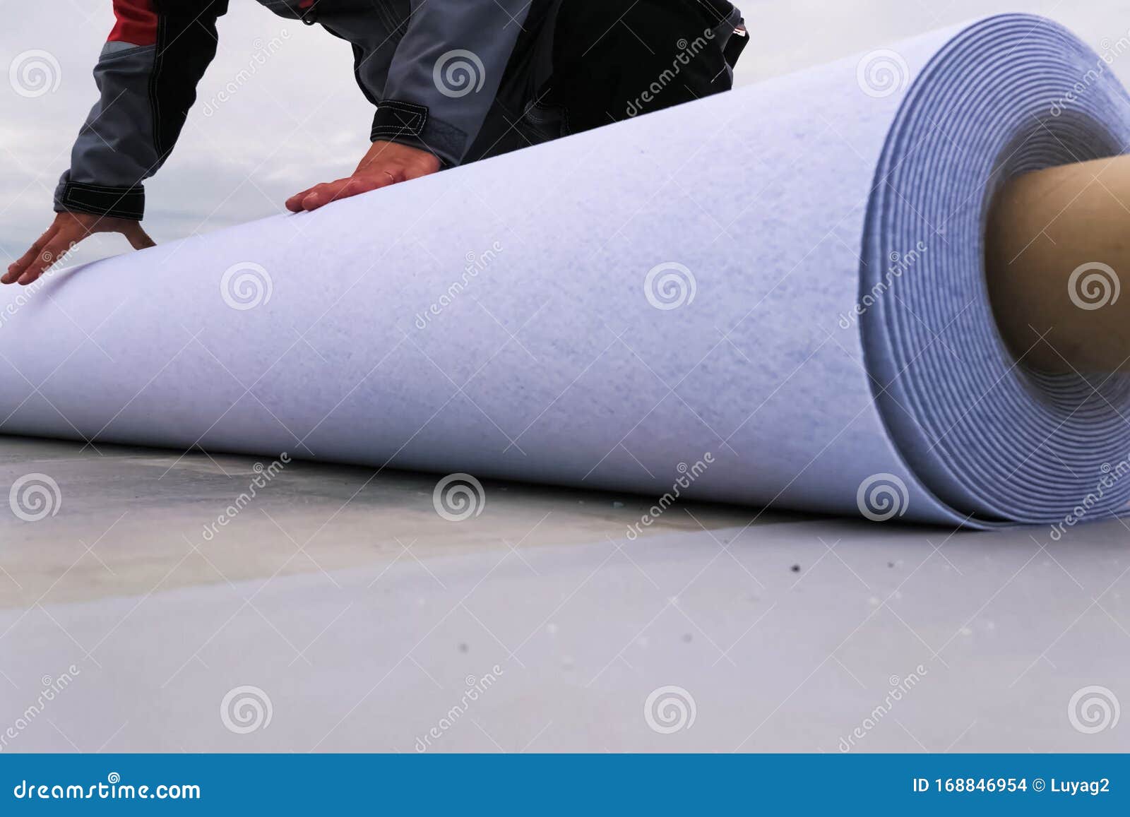 Rolls of Polymer Coating for Roof. Deployment of a Roof Covering Roll ...