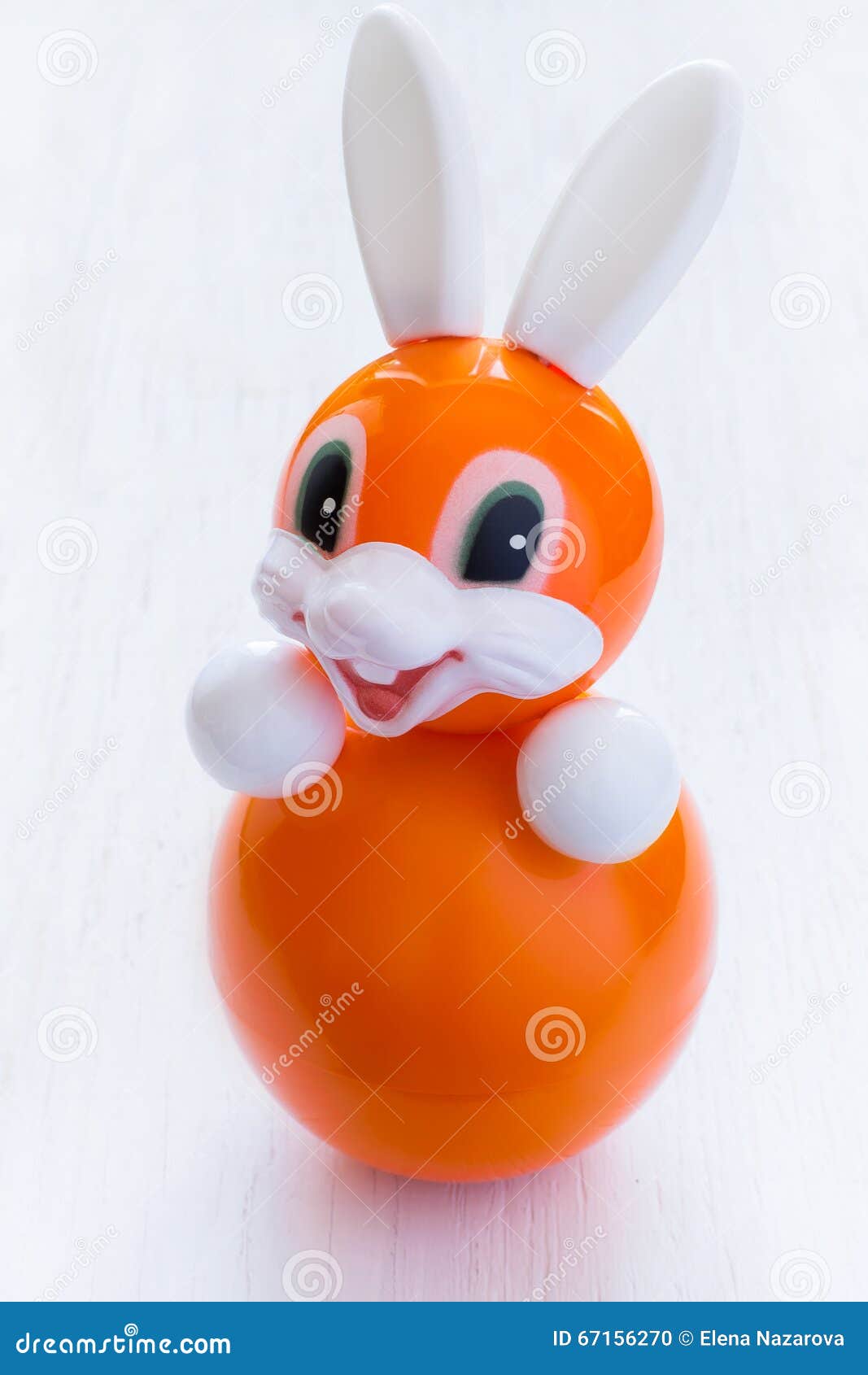 Roly-poly Toy Rabbit in Orange on a White Background Stock Photo ...