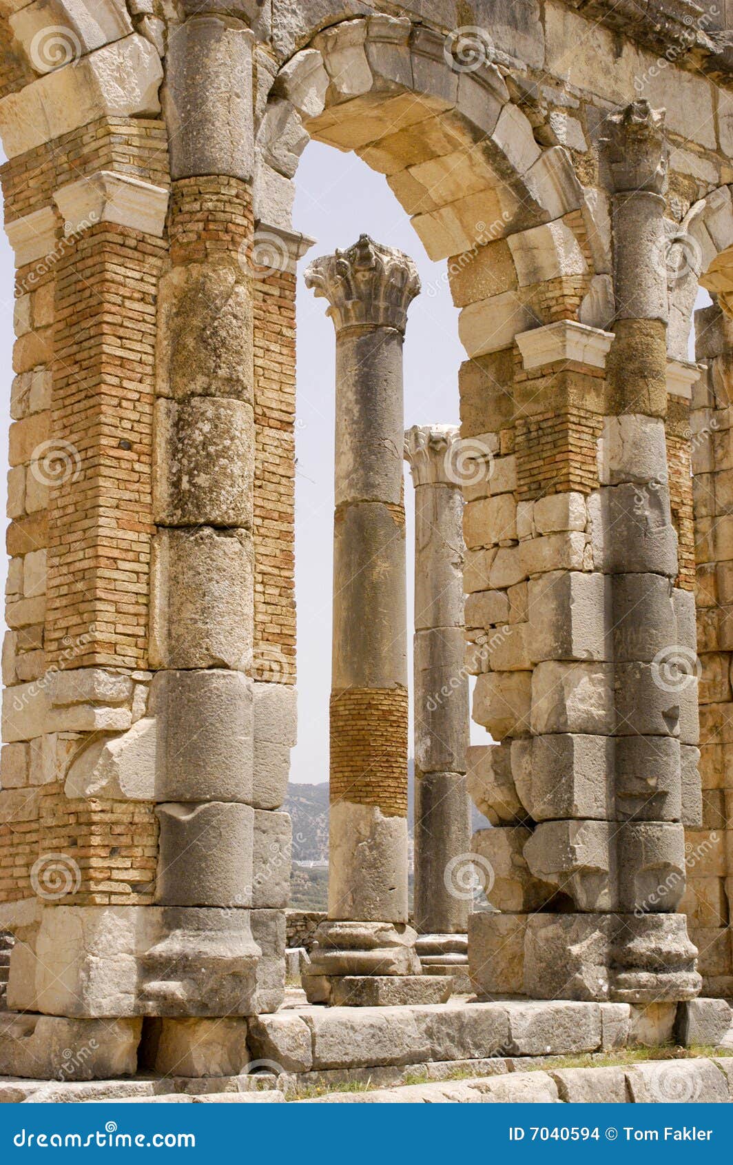 Roman Columns Of The Ruins In Front Of Ancient Roman Amphitheatre In ...