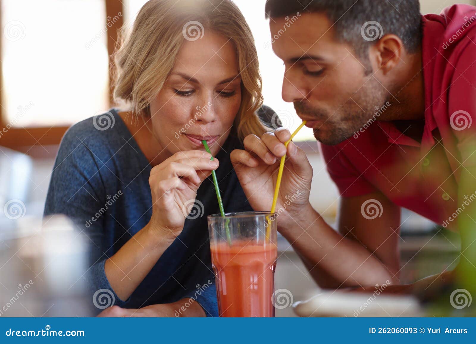 Romance is Thirsty Work. a Happy Young Couple Sharing a Milkshake ...