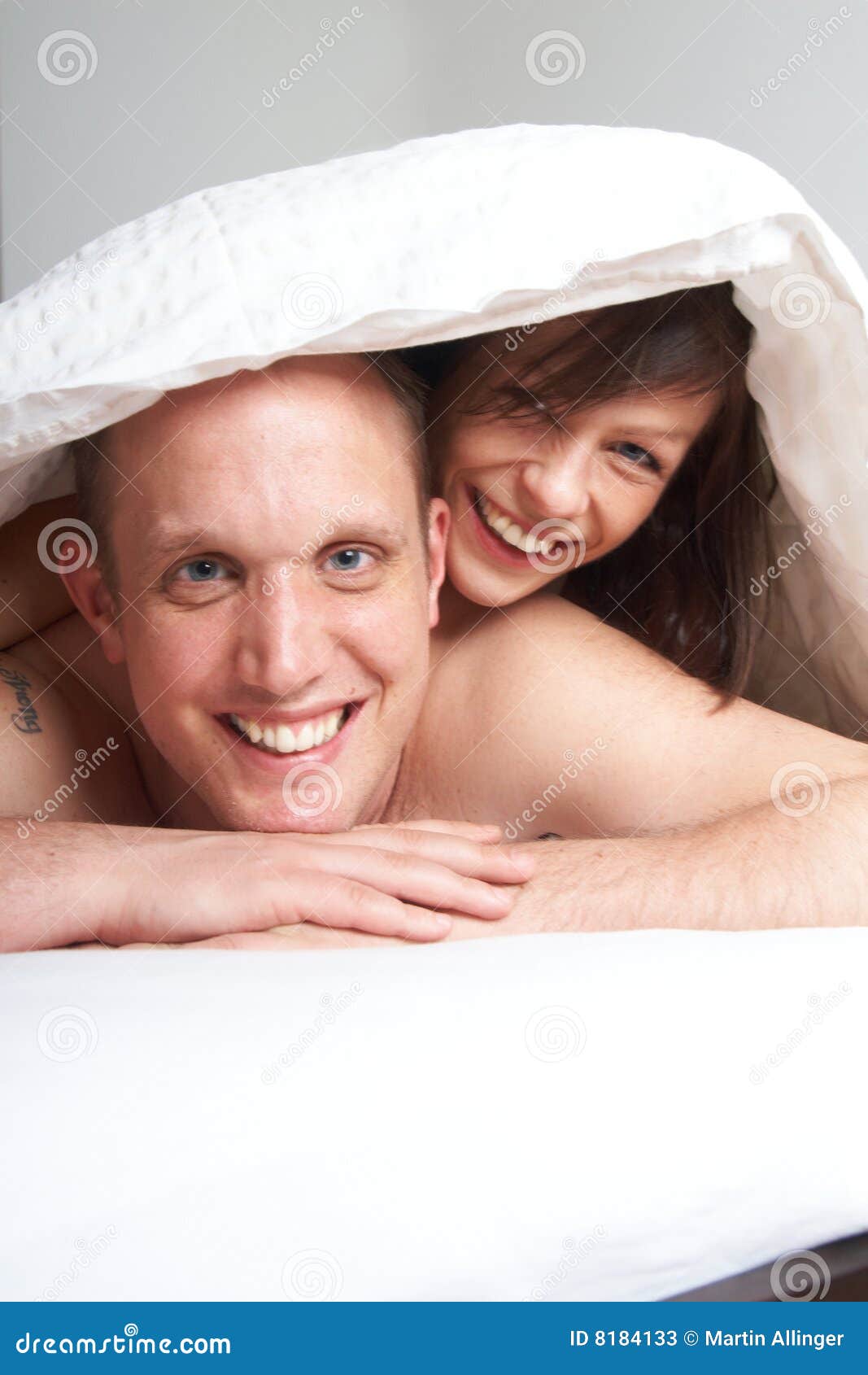 Romance under the sheets stock image. Image of hand, adult - 8184133
