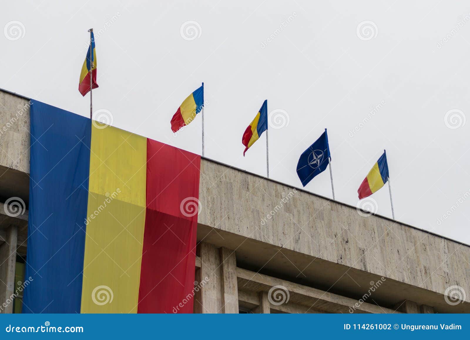 Romanian and NATO Flags in the Wind Editorial Photography - Image of ...