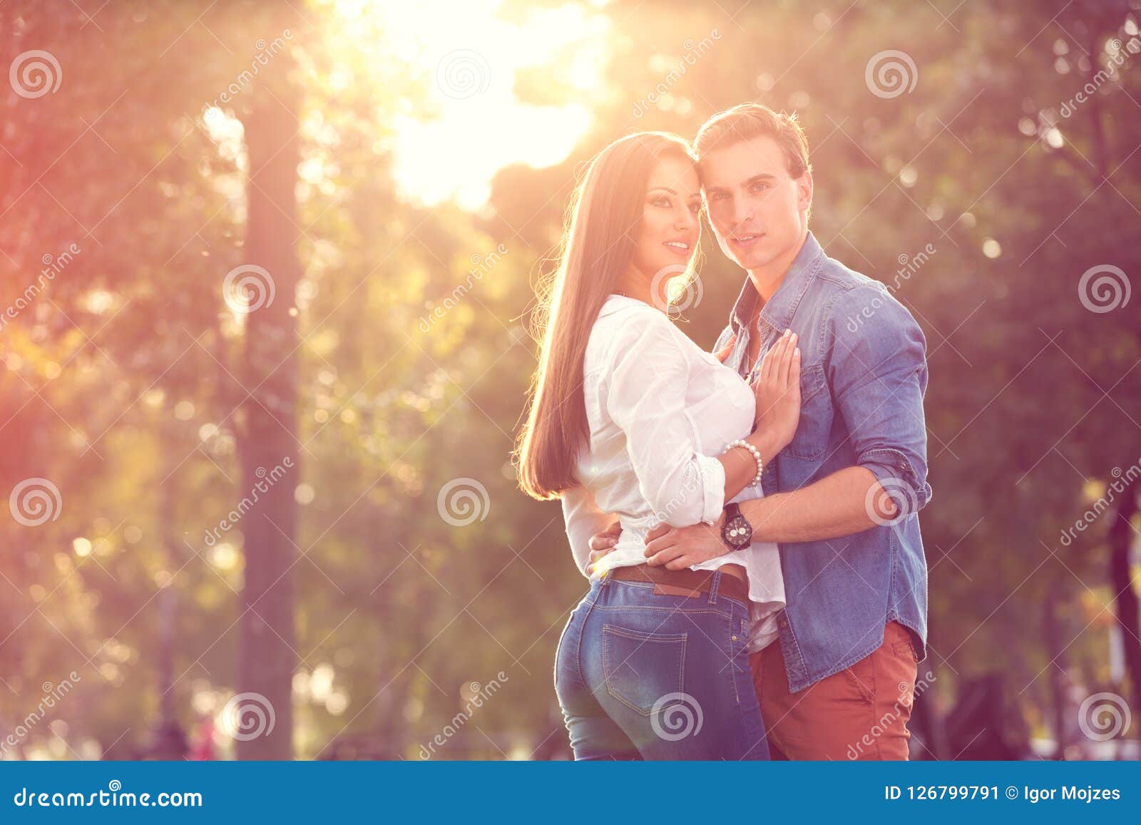 Autumn couple embracing stock image. Image of person - 126799791