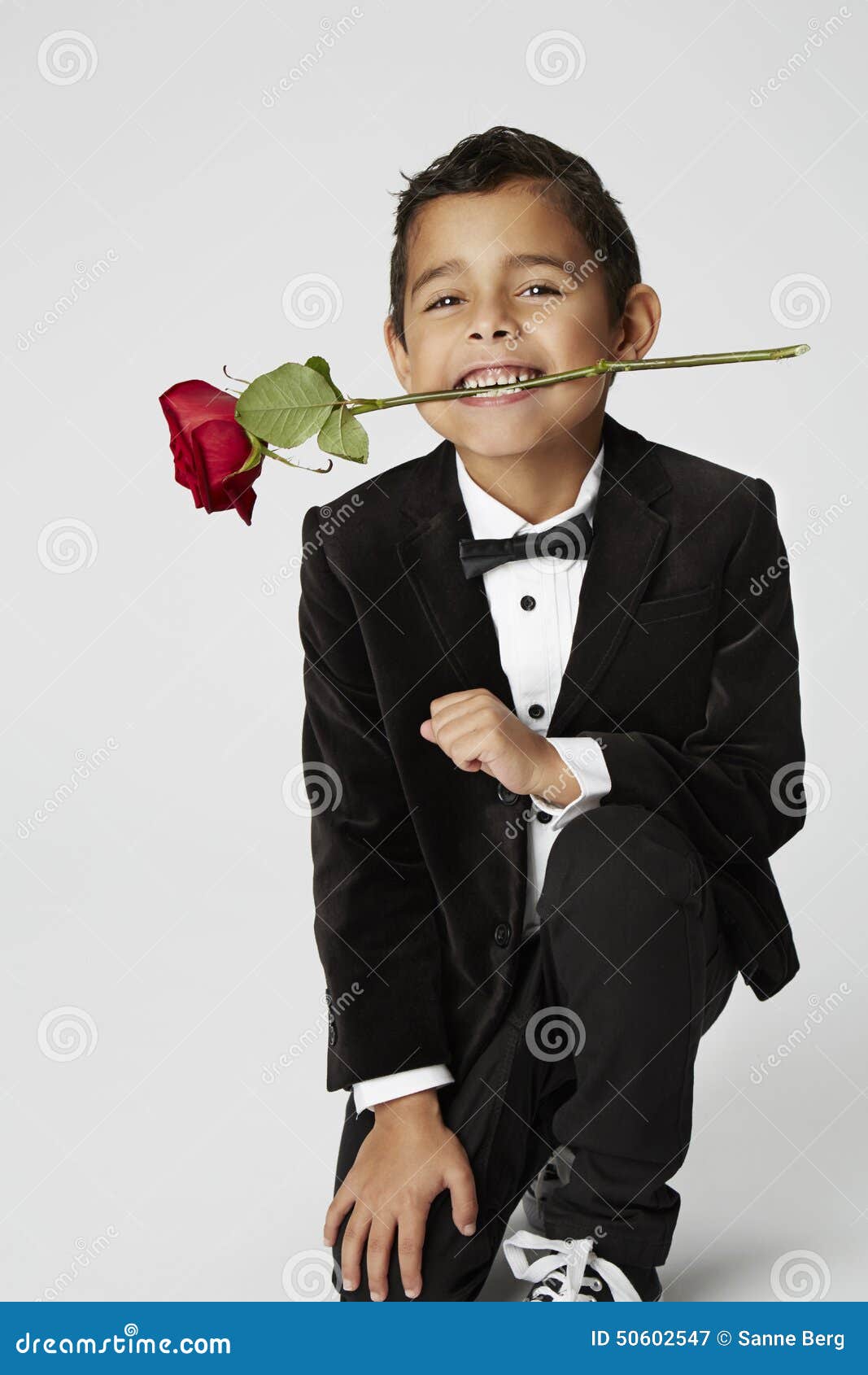 Romantic boy holding rose stock image. Image of background - 50602547