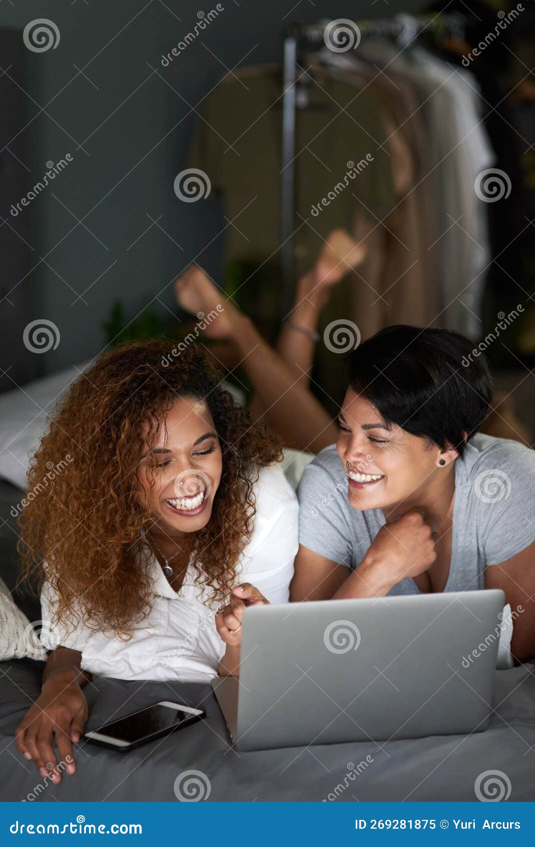 A Romantic Comedy is always a Winner with Us. a Young Couple Using a ...