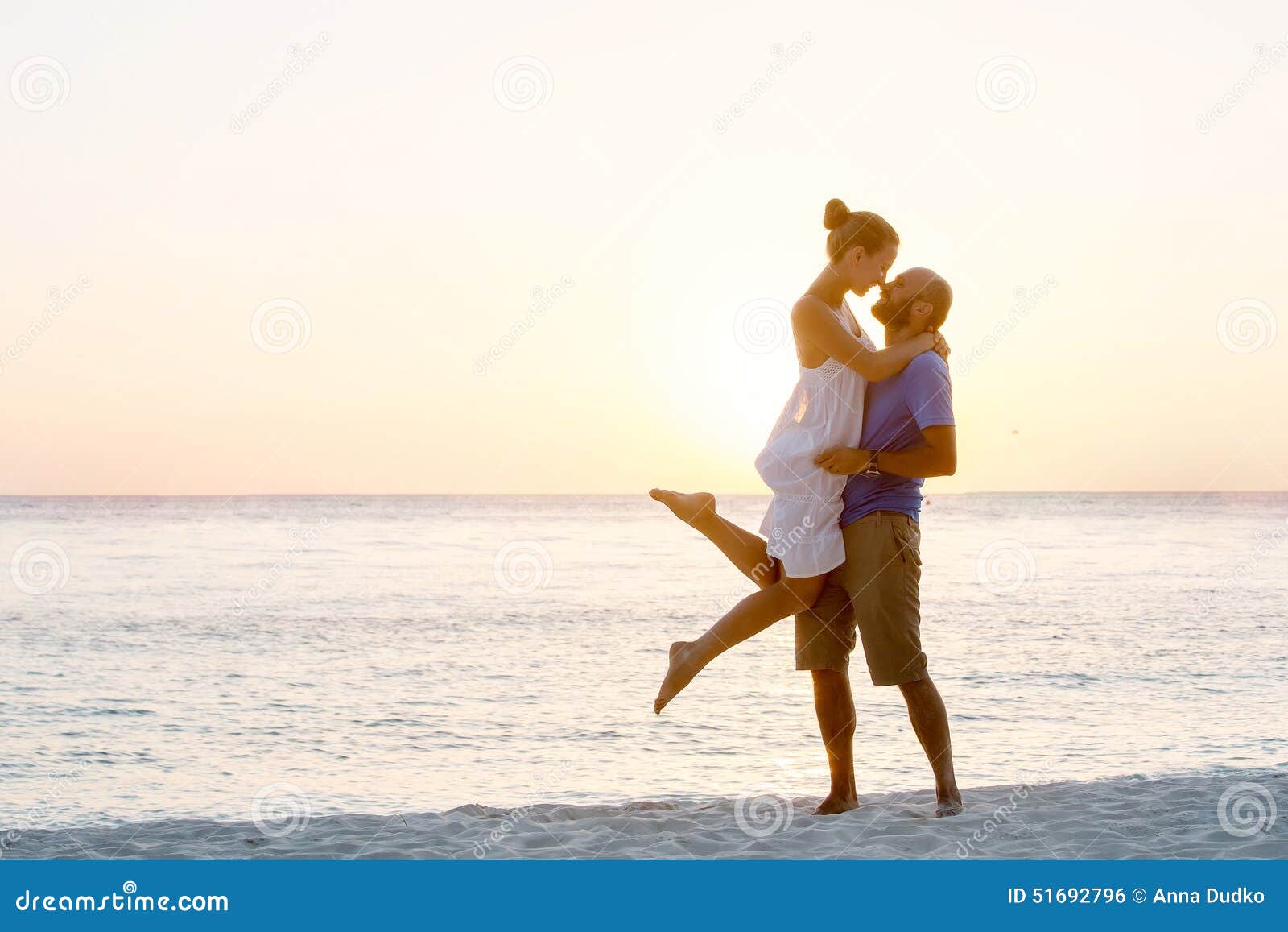 Romantic Couple on the Beach at Colorful Sunset Stock Photo - Image of ...
