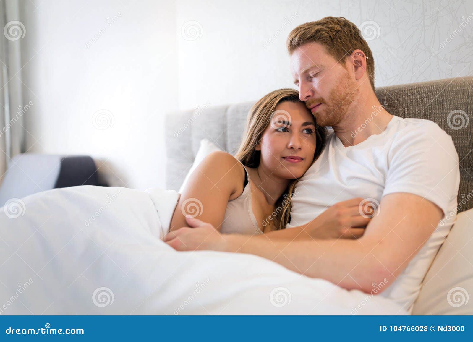 Romantic couple in bed stock photo. Image of love, romance - 104766028