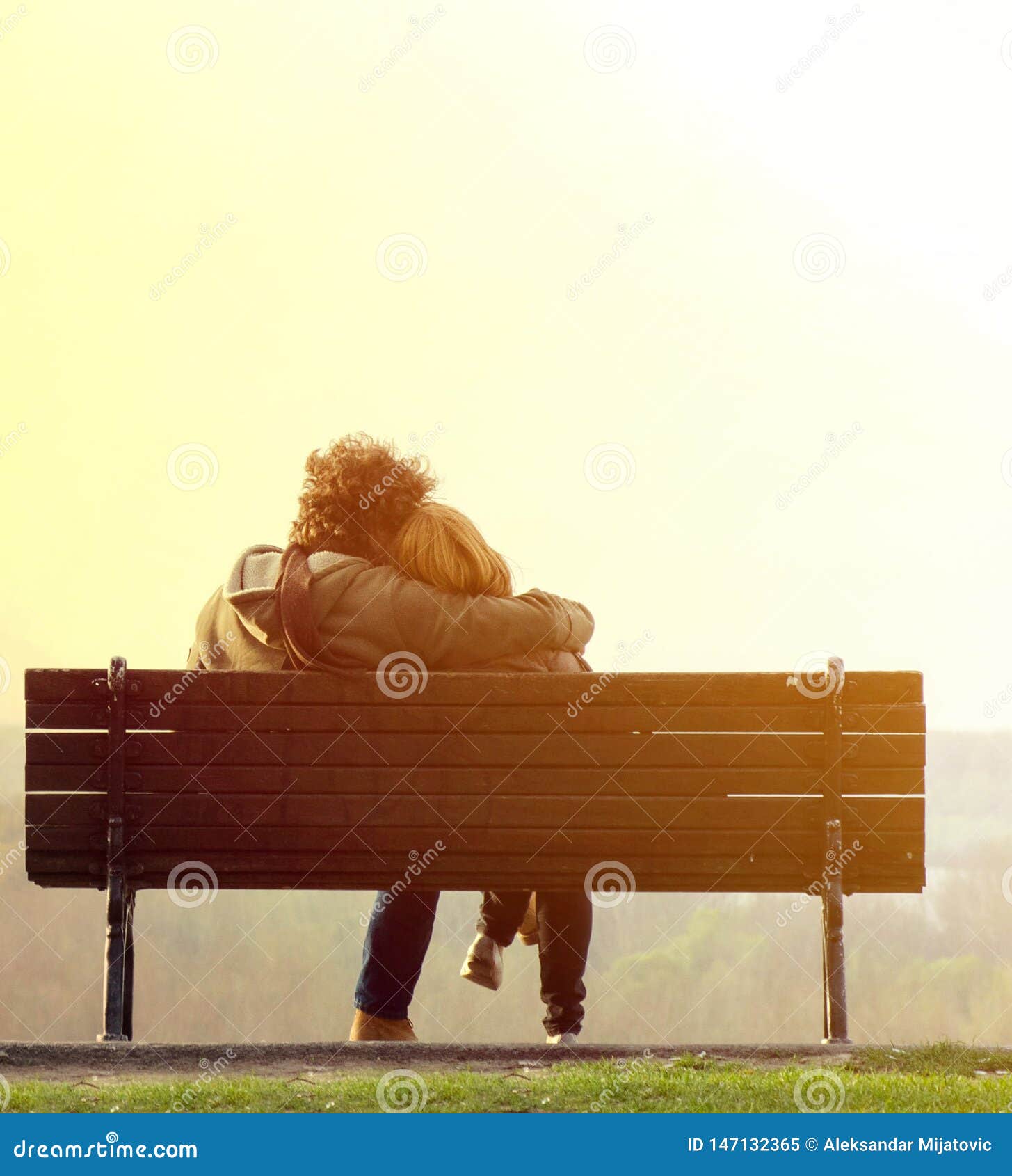 Romantic couple on bench stock image. Image of sunset - 147132365
