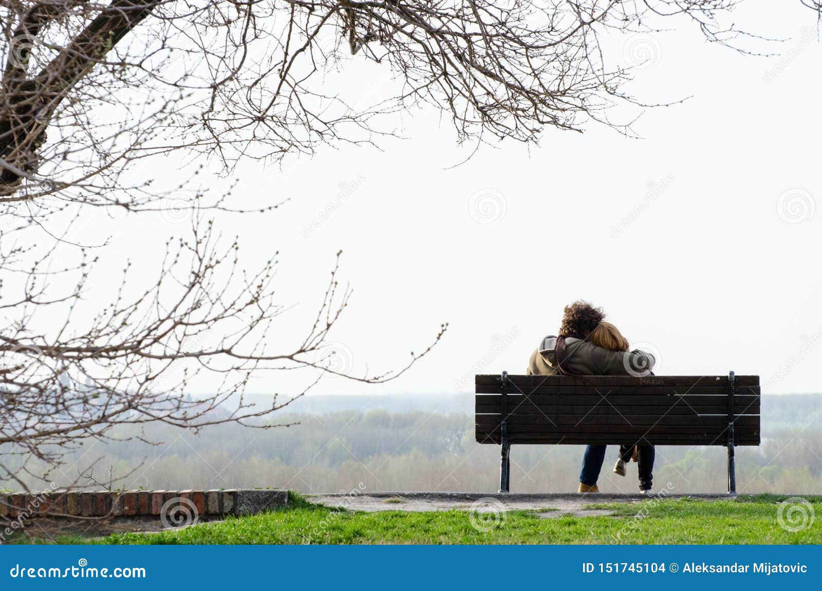 Romantic couple on bench stock photo. Image of friends - 151745104