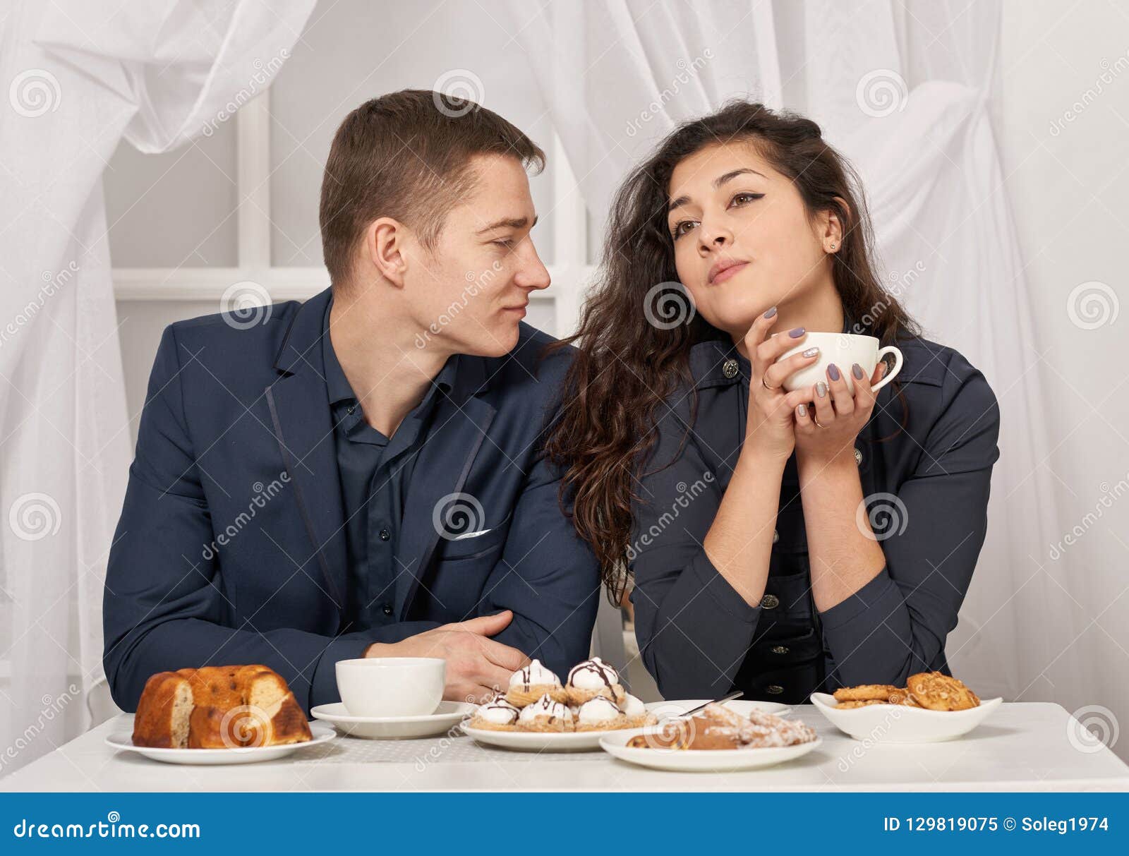 Romantic Couple Drinking Tea with Cookies and Talking Stock Image ...