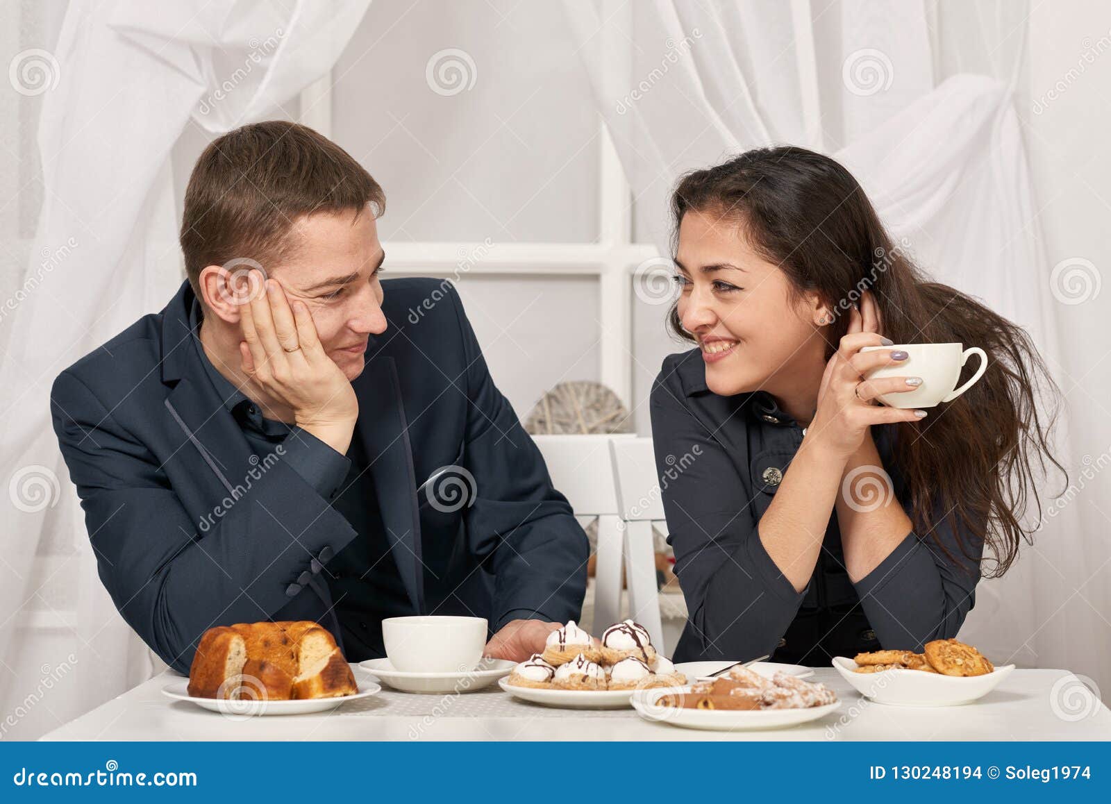 Romantic Couple Drinking Tea with Cookies and Talking Stock Photo ...