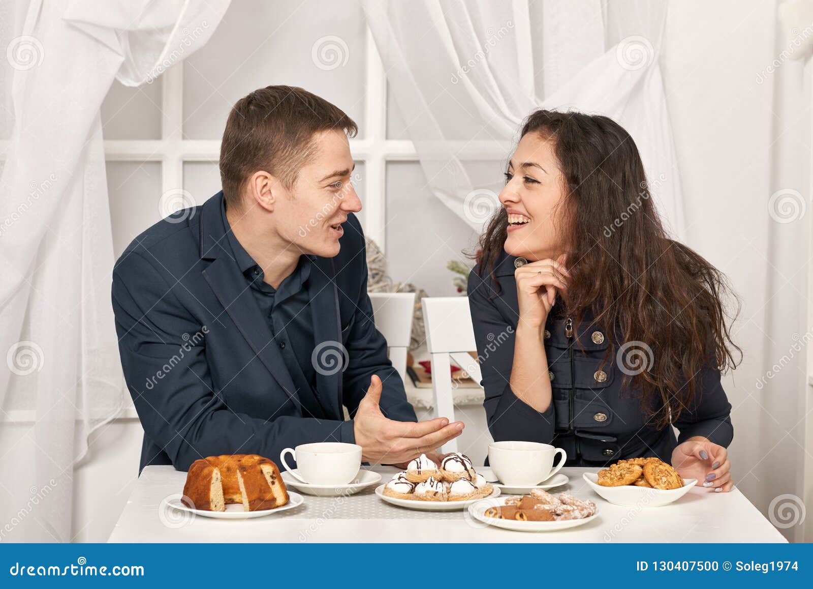 Romantic Couple Drinking Tea with Cookies and Talking Stock Photo ...