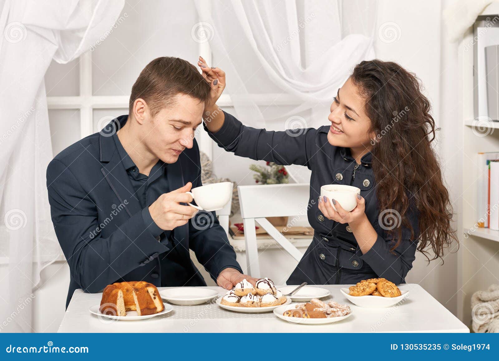 Romantic Couple Drinking Tea with Cookies and Talking Stock Image ...