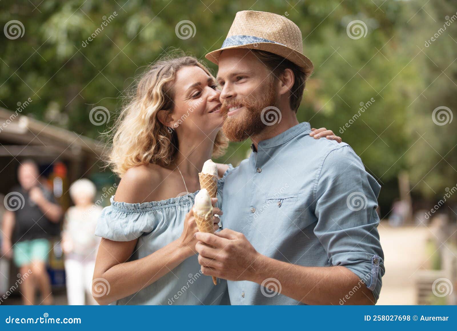 Romantic Couple Eating Ice Cream at Park Stock Photo - Image of ...
