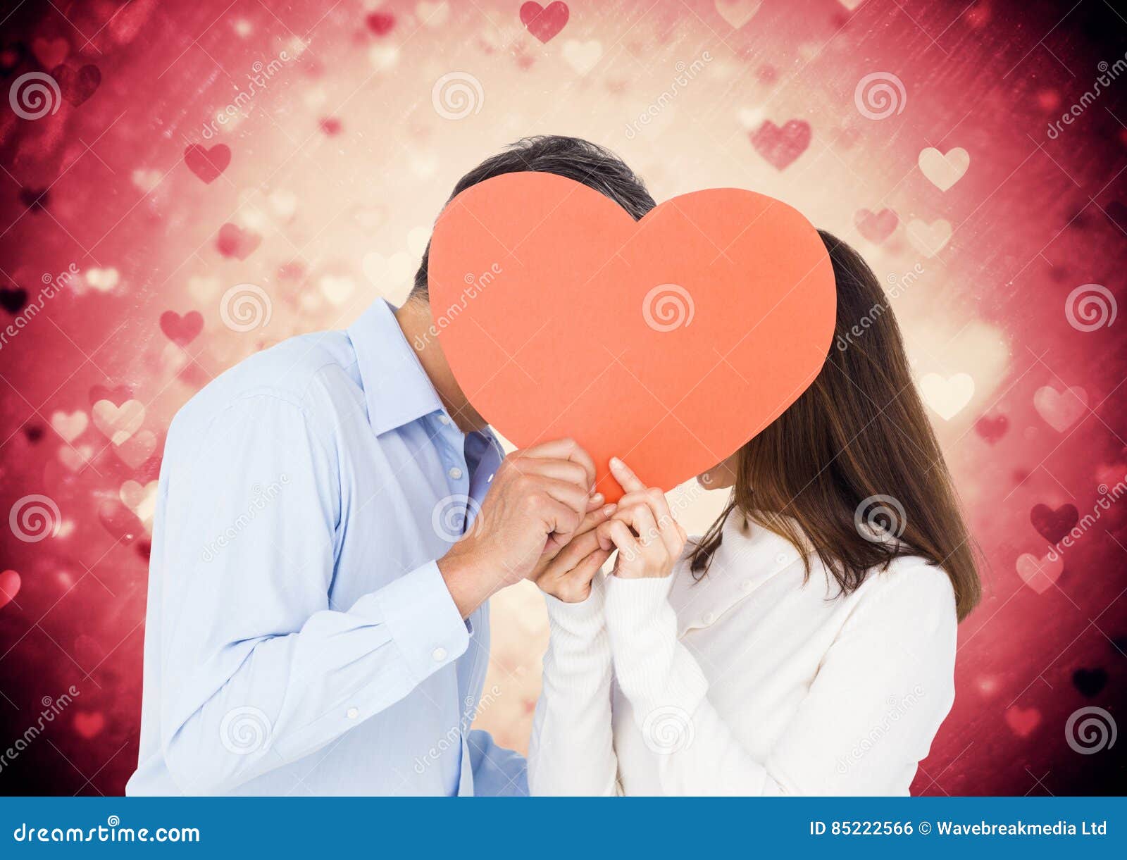 Romantic Couple Hiding Their Face Behind Heart Stock Photo - Image of ...