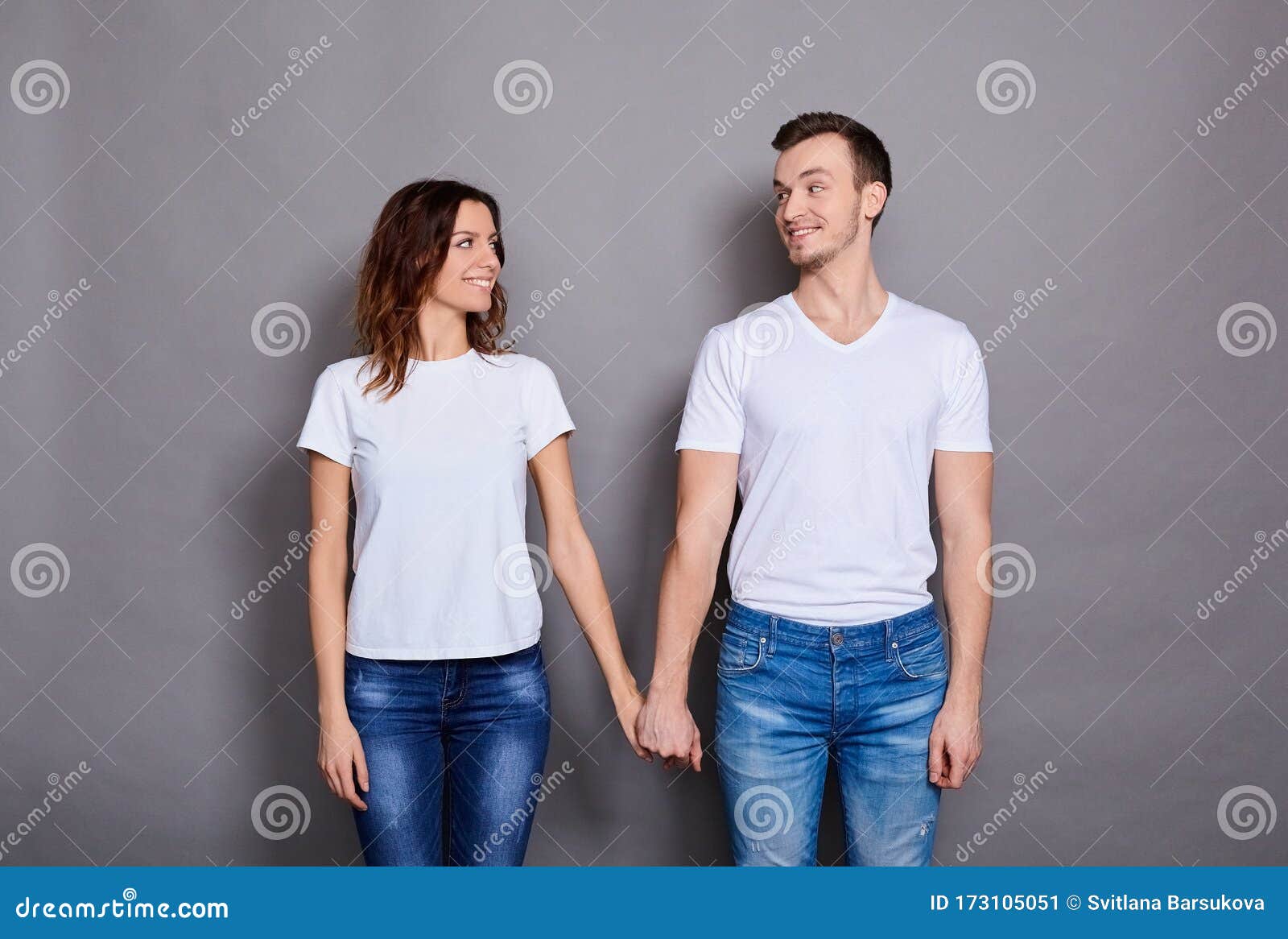 Romantic Couple Holds Hands And Look In Love At Each Other Stock Image