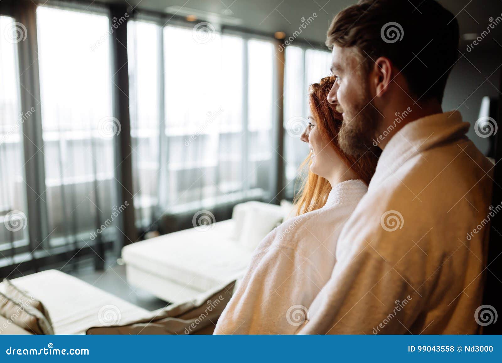 Romantic couple hugging stock photo. Image of homey, cheerful - 99043558