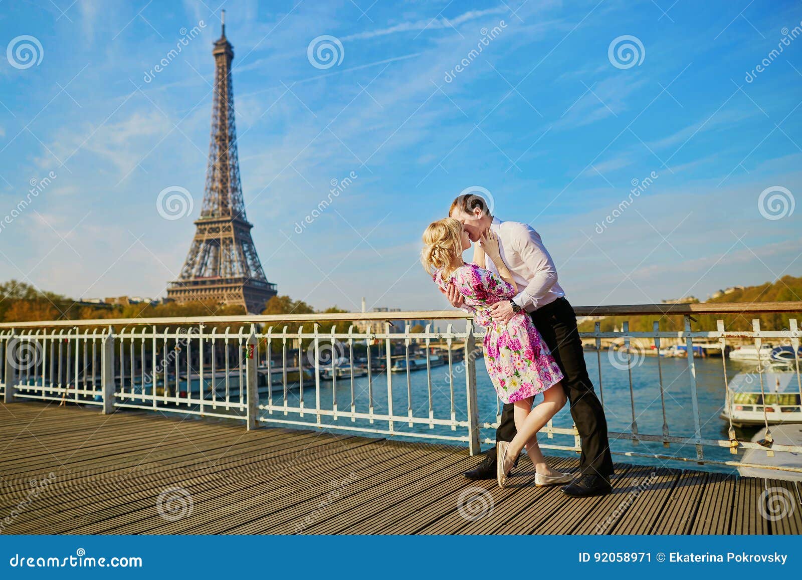Romantic Couple Kissing Near The Eiffel Tower In Paris France Stock