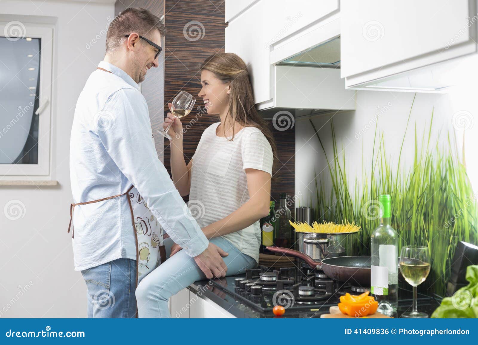 Romantic couple in kitchen stock photo. Image of ethnicity - 41409836