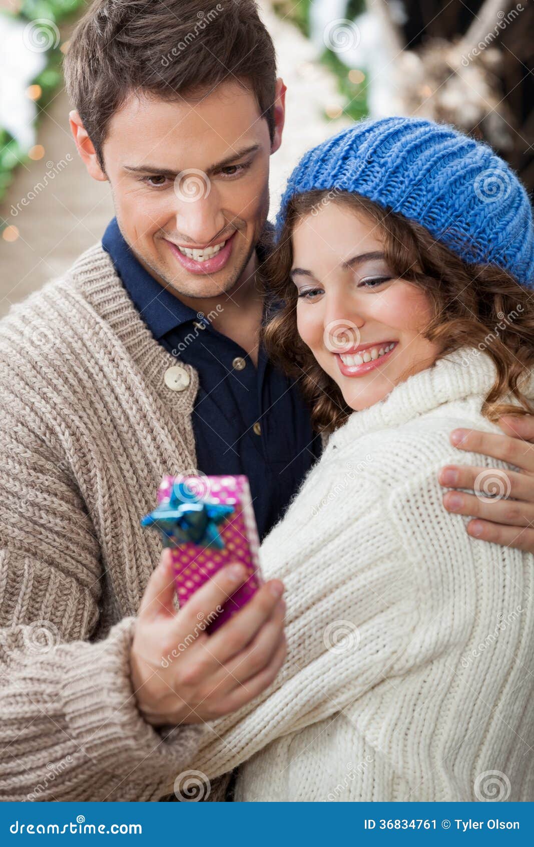 Romantic Couple Looking at Gift Box in Store Stock Image - Image of ...