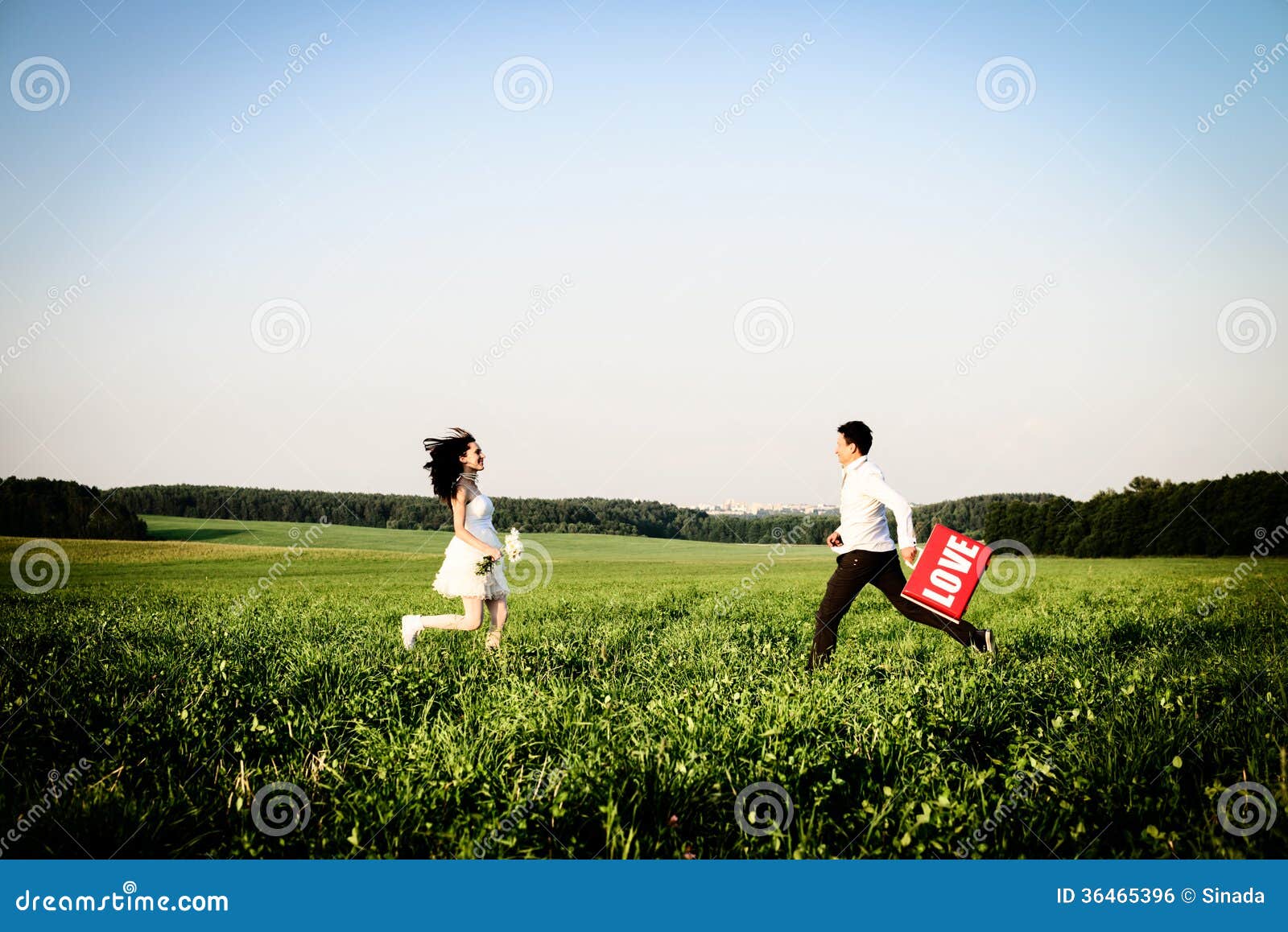 Romantic Couple of Lovers in Field Runs Towards Each Other Stock Photo ...
