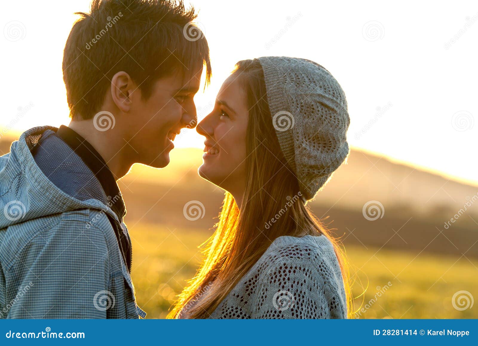 Romantic Couple Showing Affection at Sunset. Stock Photo - Image of ...