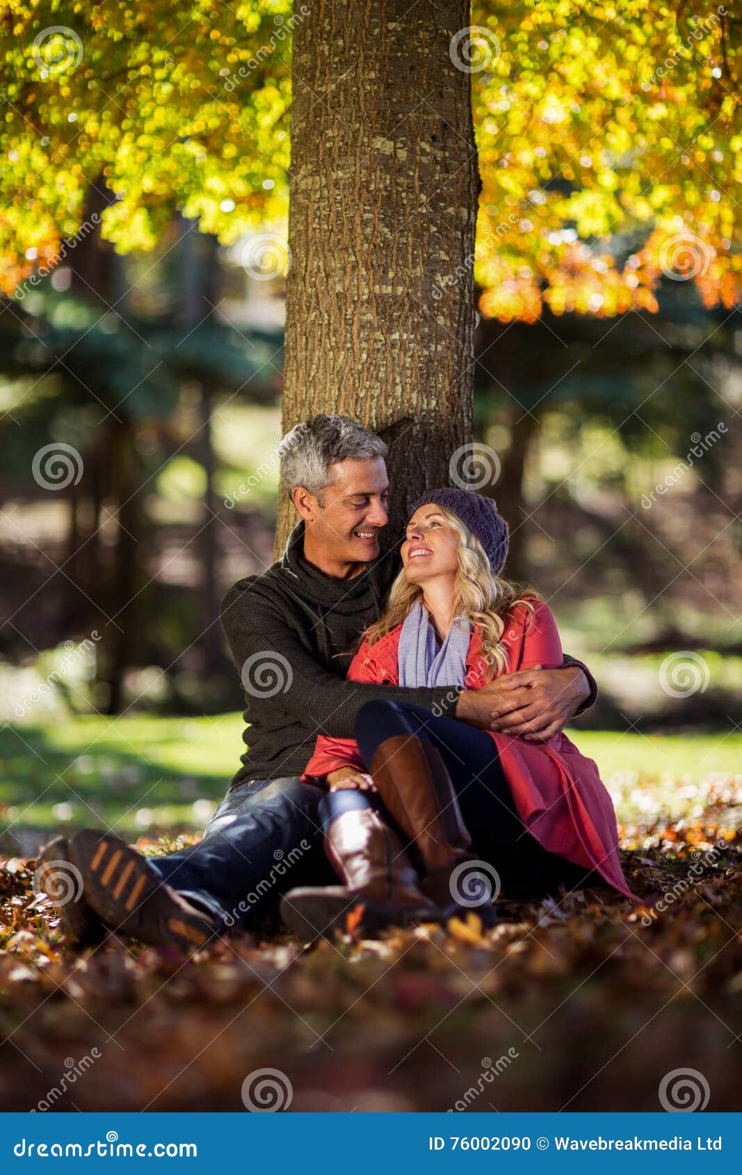 Romantic Couple Sitting Under Tree at Park Stock Photo - Image of ...