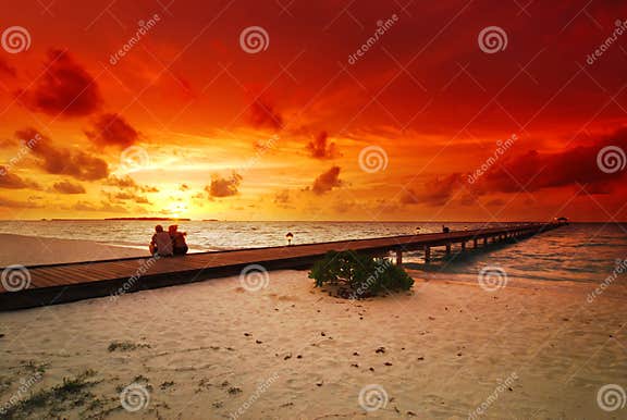 Romantic couple and sunset stock photo. Image of ocean - 8758842