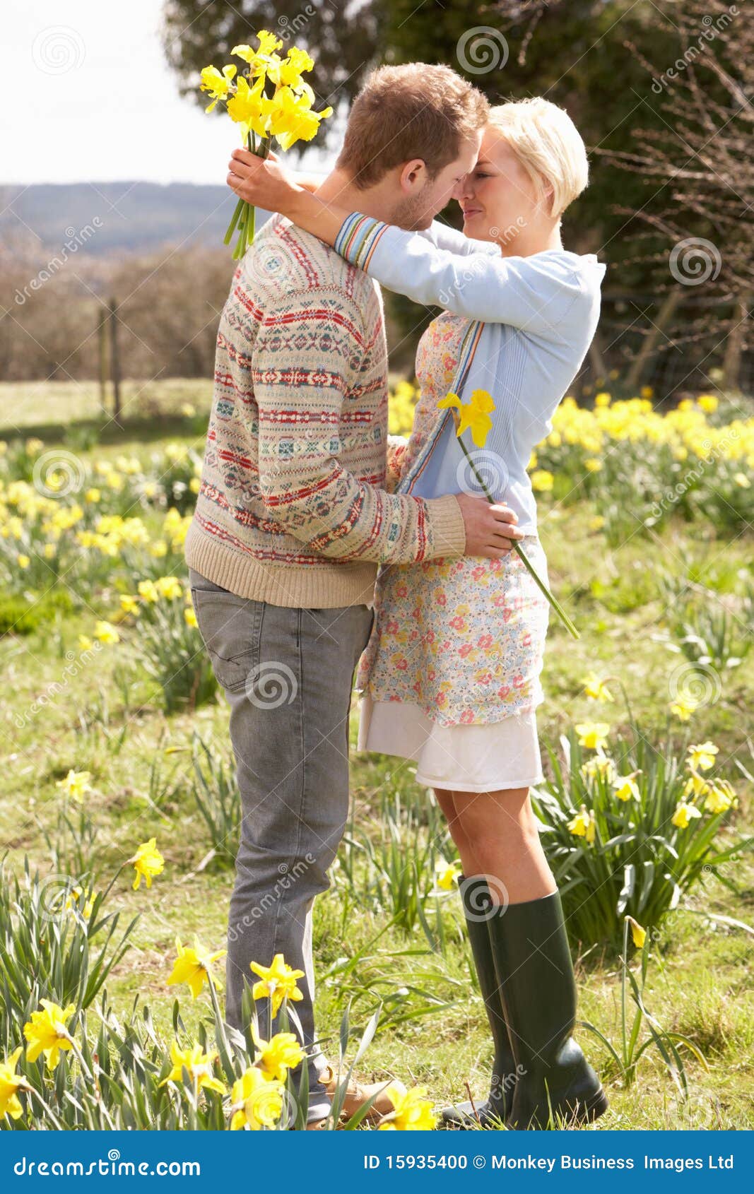 Romantic Couple Walking Amongst Spring Daffodils Stock Photo - Image of ...