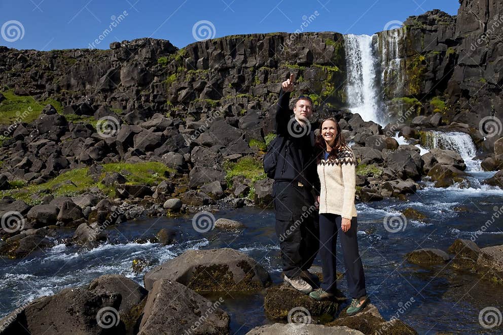 Romantic Couple by a Waterfall Stock Photo - Image of scandinavian ...