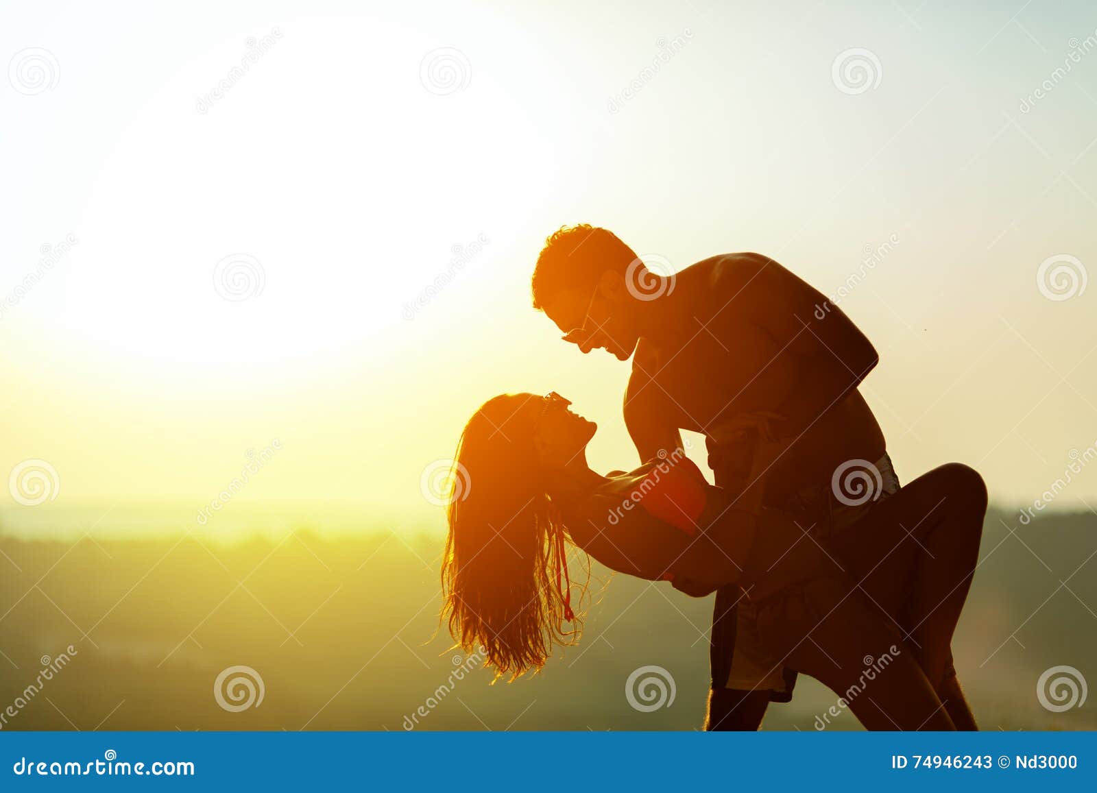 Romantic Dance at Sunset by Couple Stock Image - Image of evening, seaside: 74946243