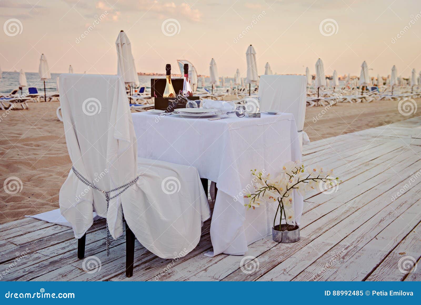 Romantic Dinner Setup ,on the Beach with Sunset. Stock Image - Image of ...