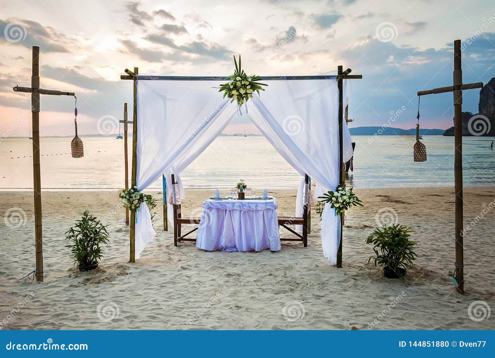 Romantic Dinner Table on the Beach during Beautiful Sunset Stock Photo ...